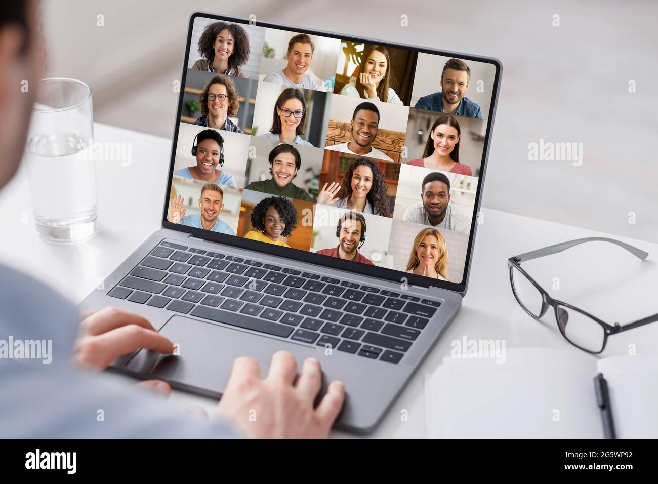 Multiethnic group of people using laptop for online conference meeting ...