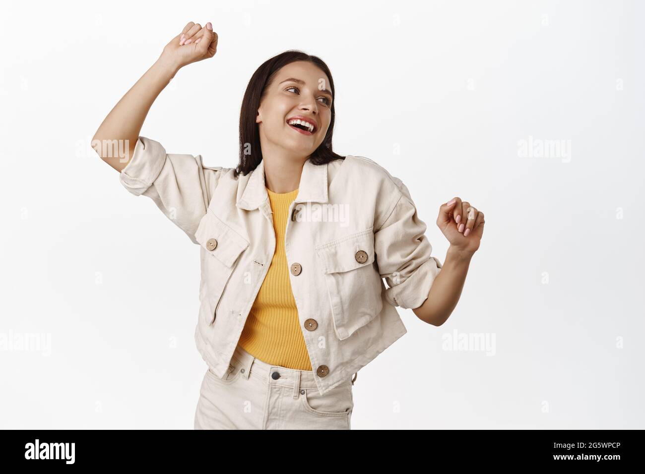 Beautiful woman laughing and dancing, having fun, dance to music on ...