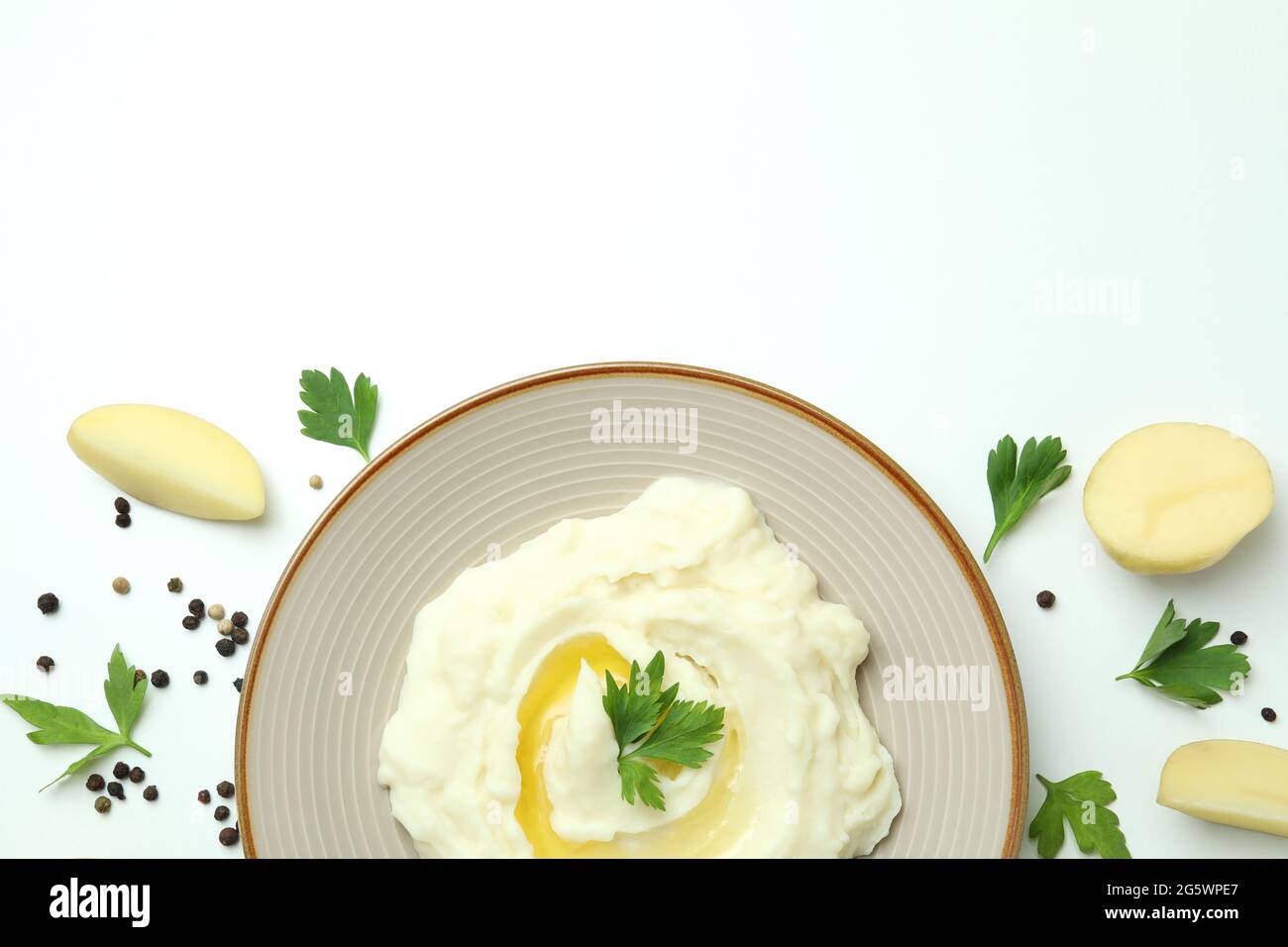Plate of mashed potatoes and ingredients on white background Stock ...