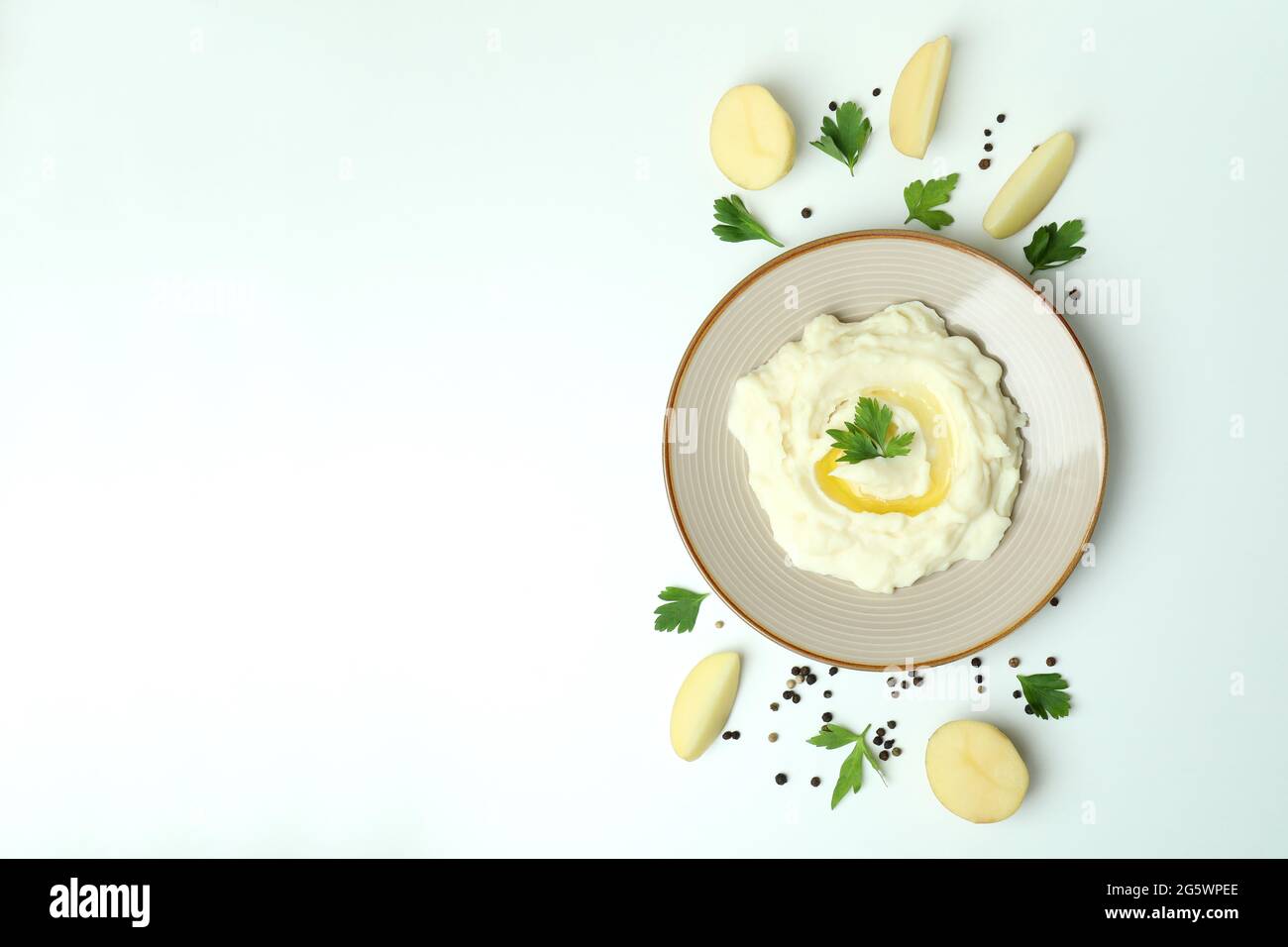 Plate of mashed potatoes and ingredients on white background Stock ...