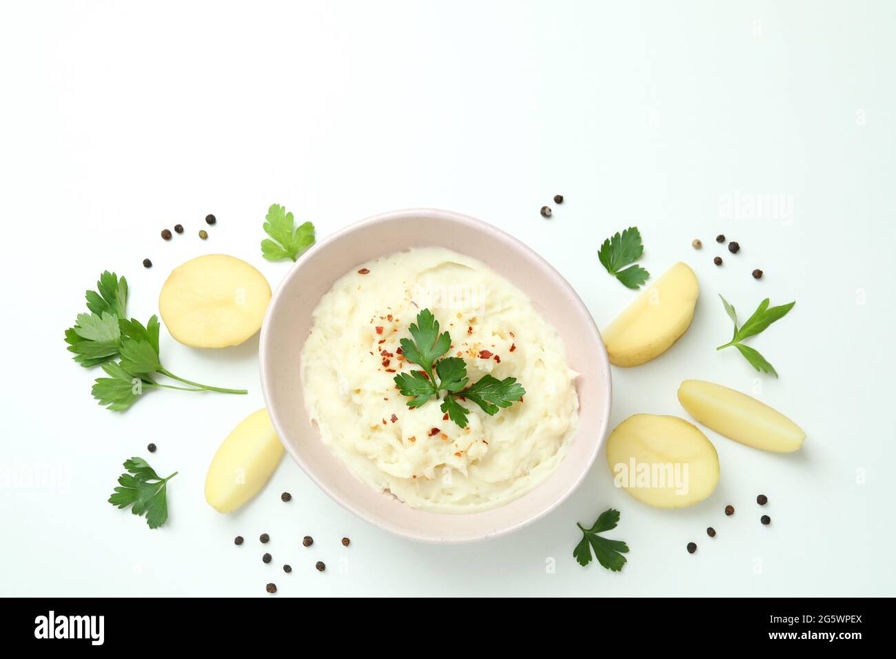 Plate of mashed potatoes and ingredients on white background Stock ...