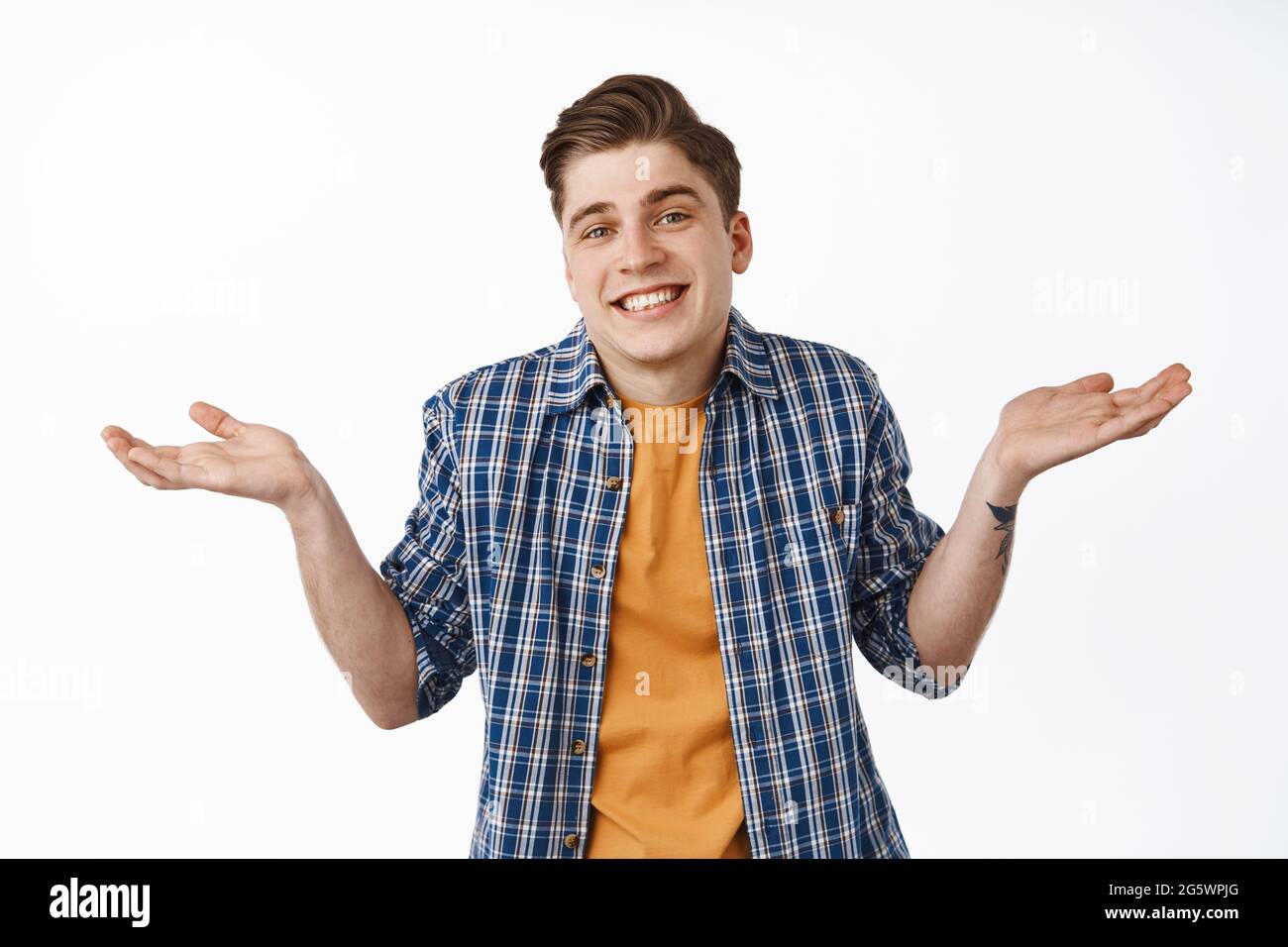 Sorry dont know. Smiling clueless guy shrugging shoulders, looking ...