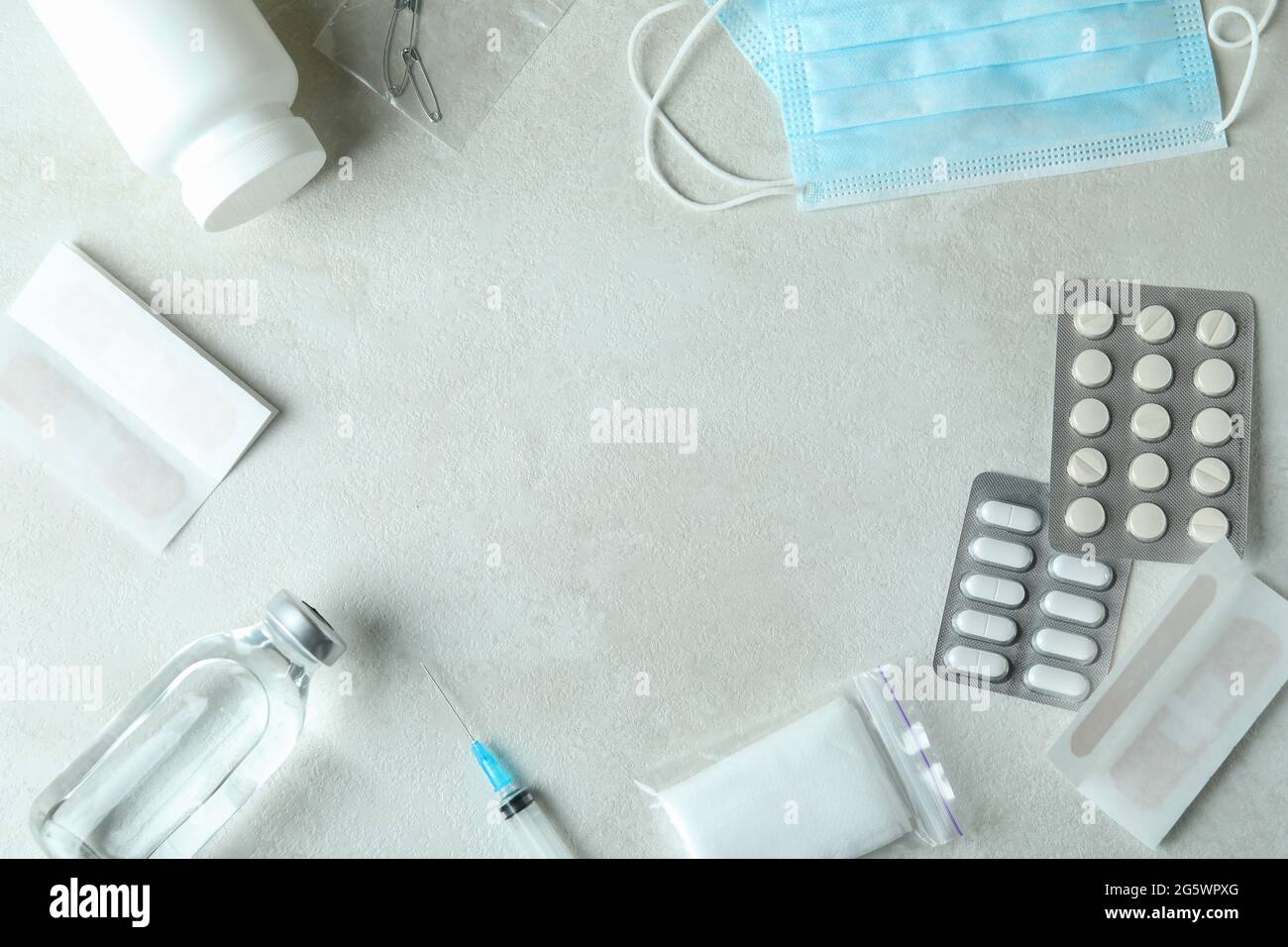 First aid medical kit on white textured table Stock Photo - Alamy
