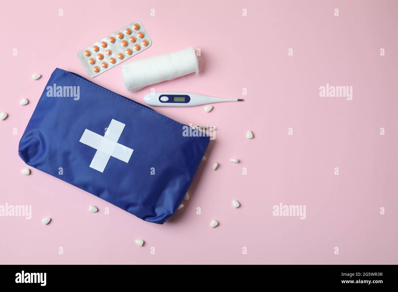 First aid medical kit on pink background Stock Photo - Alamy