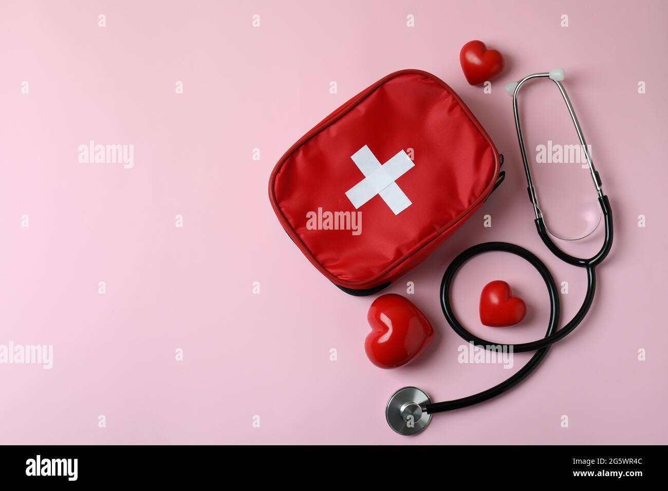 First aid medical kit on pink background Stock Photo - Alamy