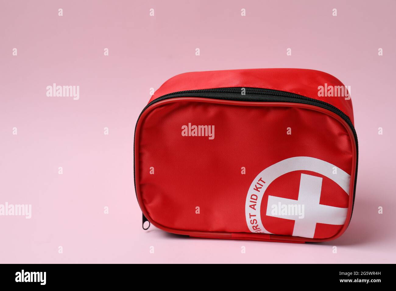 First aid medical kit on pink background Stock Photo - Alamy