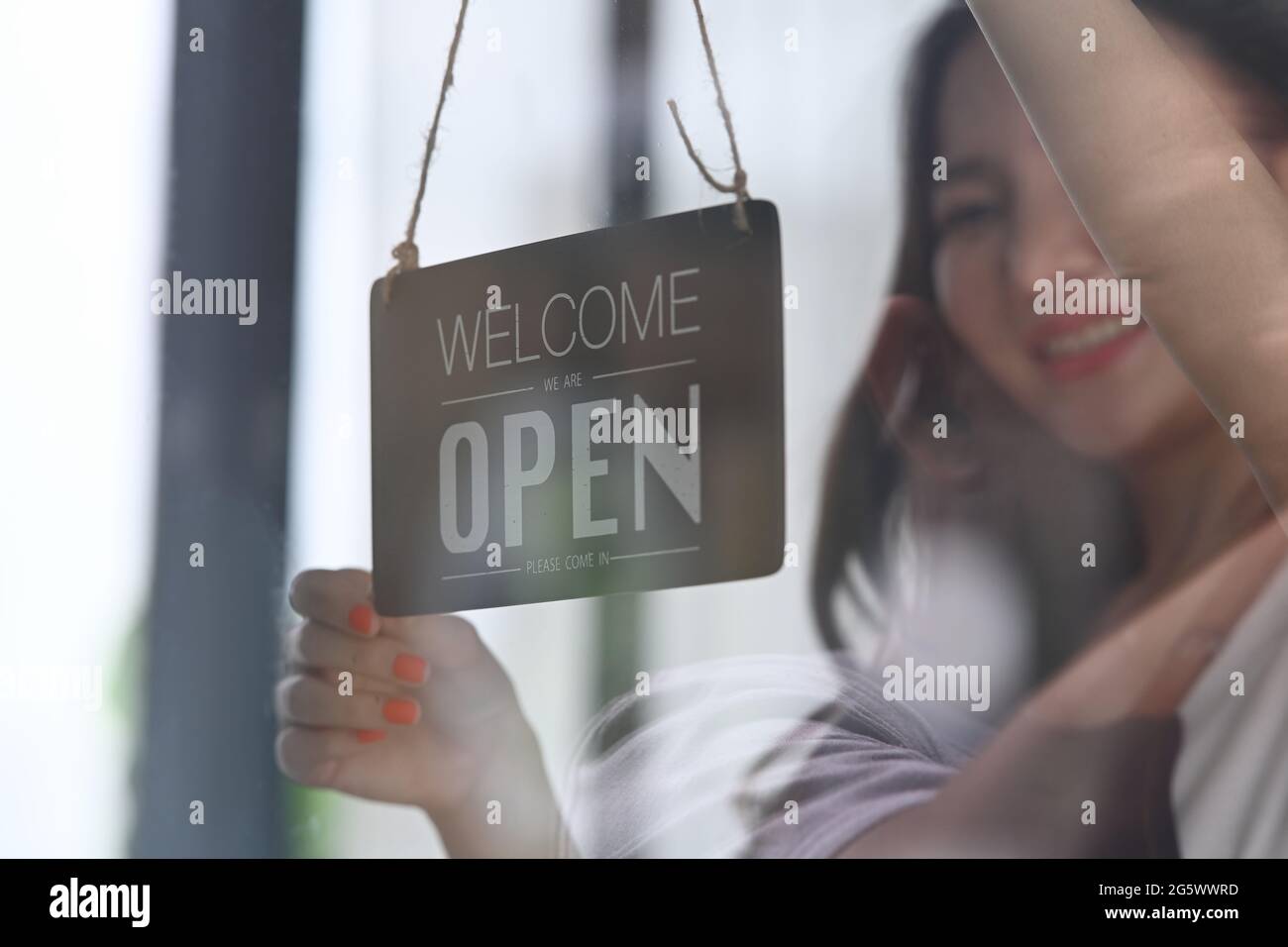 Small business owner turning open sign and ready to service Stock Photo ...