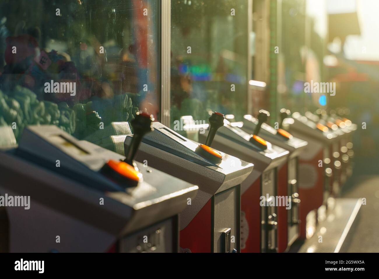 Mechanical claw game machine. Close-up view Stock Photo - Alamy