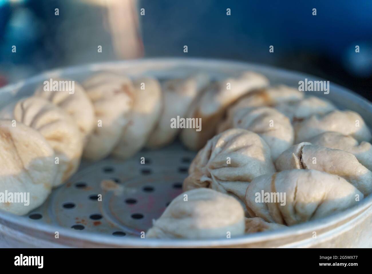 Baozi with meat filling. Street food Stock Photo - Alamy