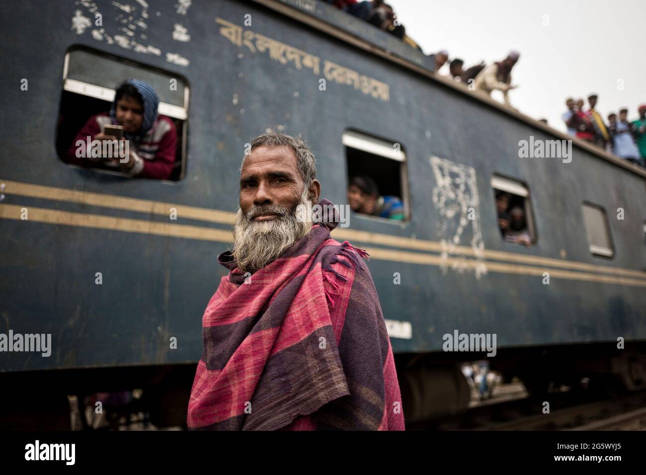 DHAKA, BANGLADESH: People piled onto the train roof and hung out the ...