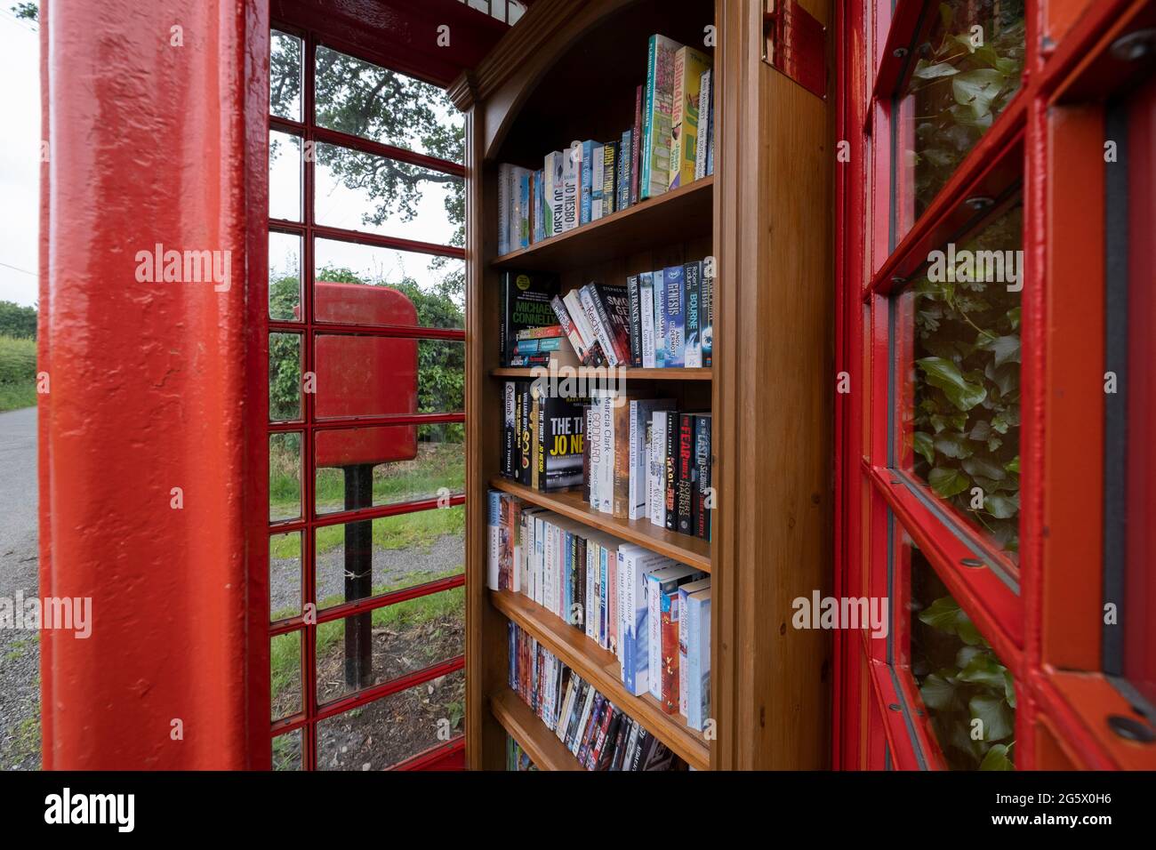 An old disused Red Telephone Box which has been converted in to a ...