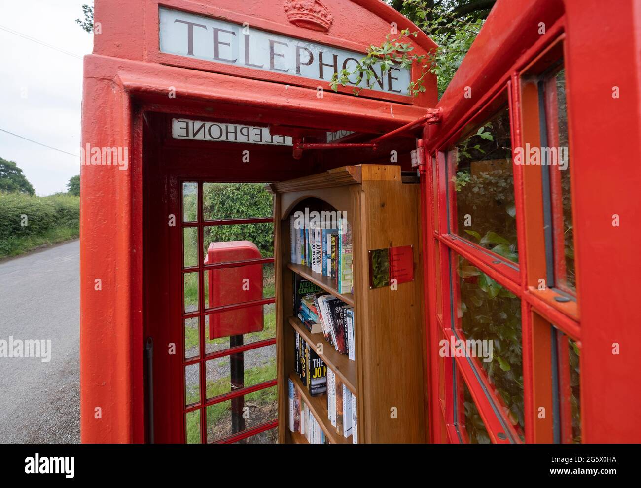 An old disused Red Telephone Box which has been converted in to a ...