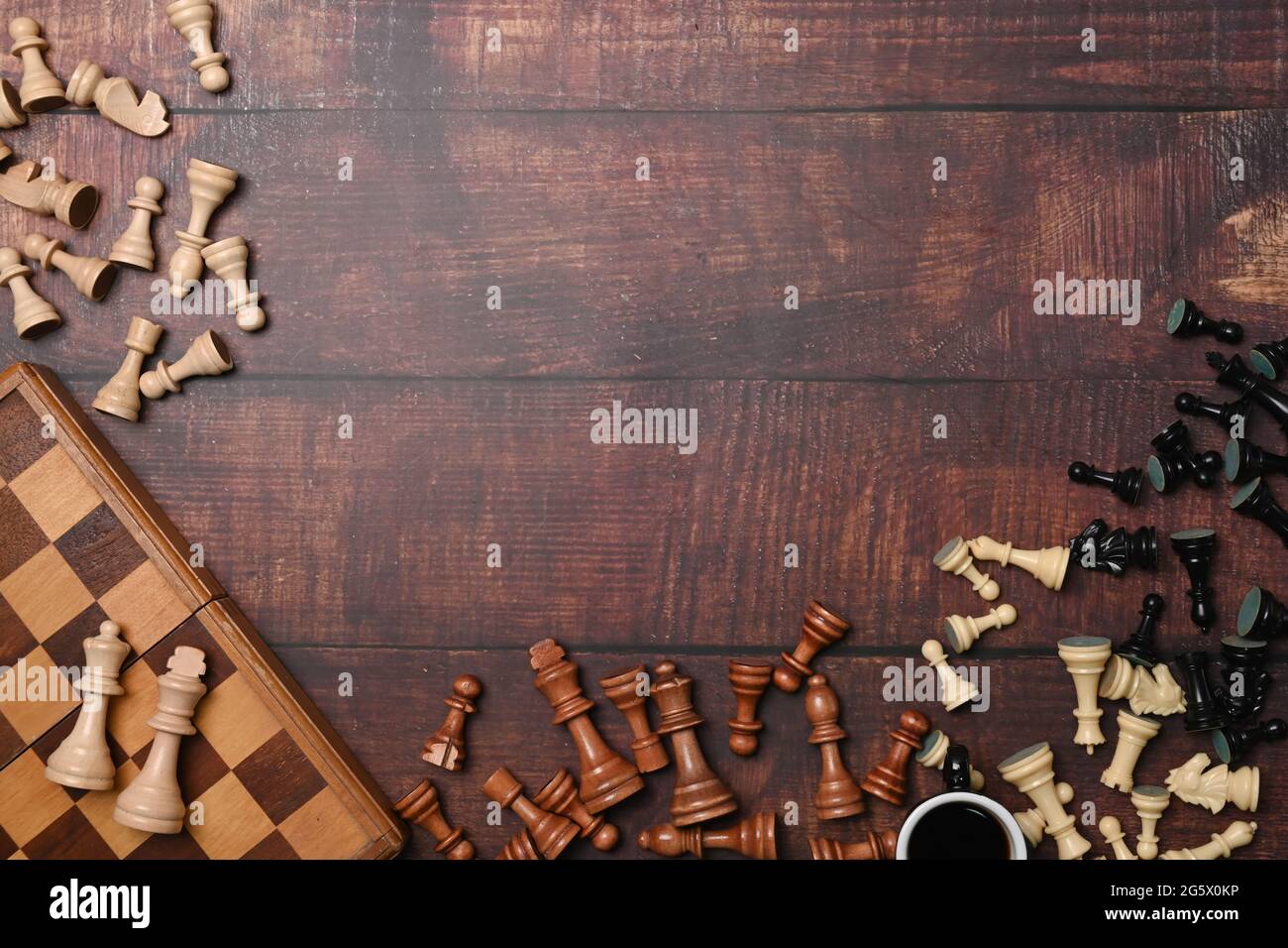 Above view chess board with chess pieces on wooden background ...