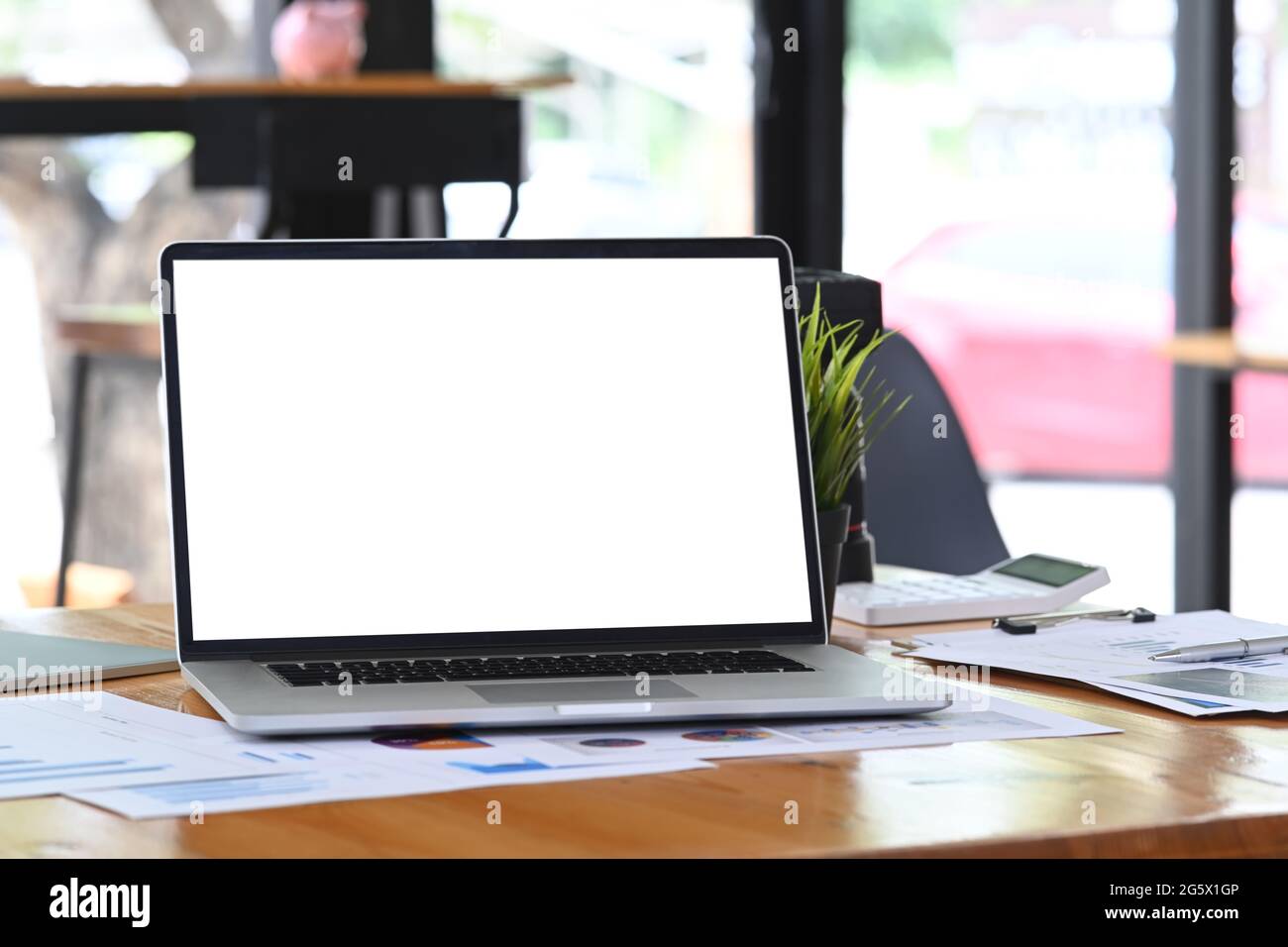 Computer laptop with blank screen and documents on office desk Stock ...