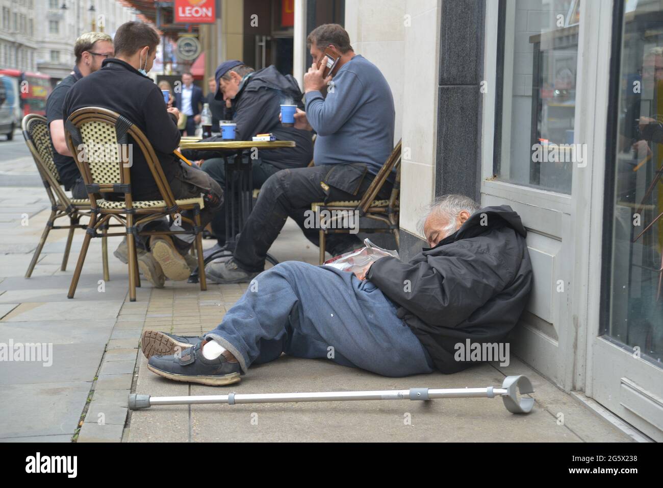 A rough sleeper on Strand street, central London.Rough sleeping has ...