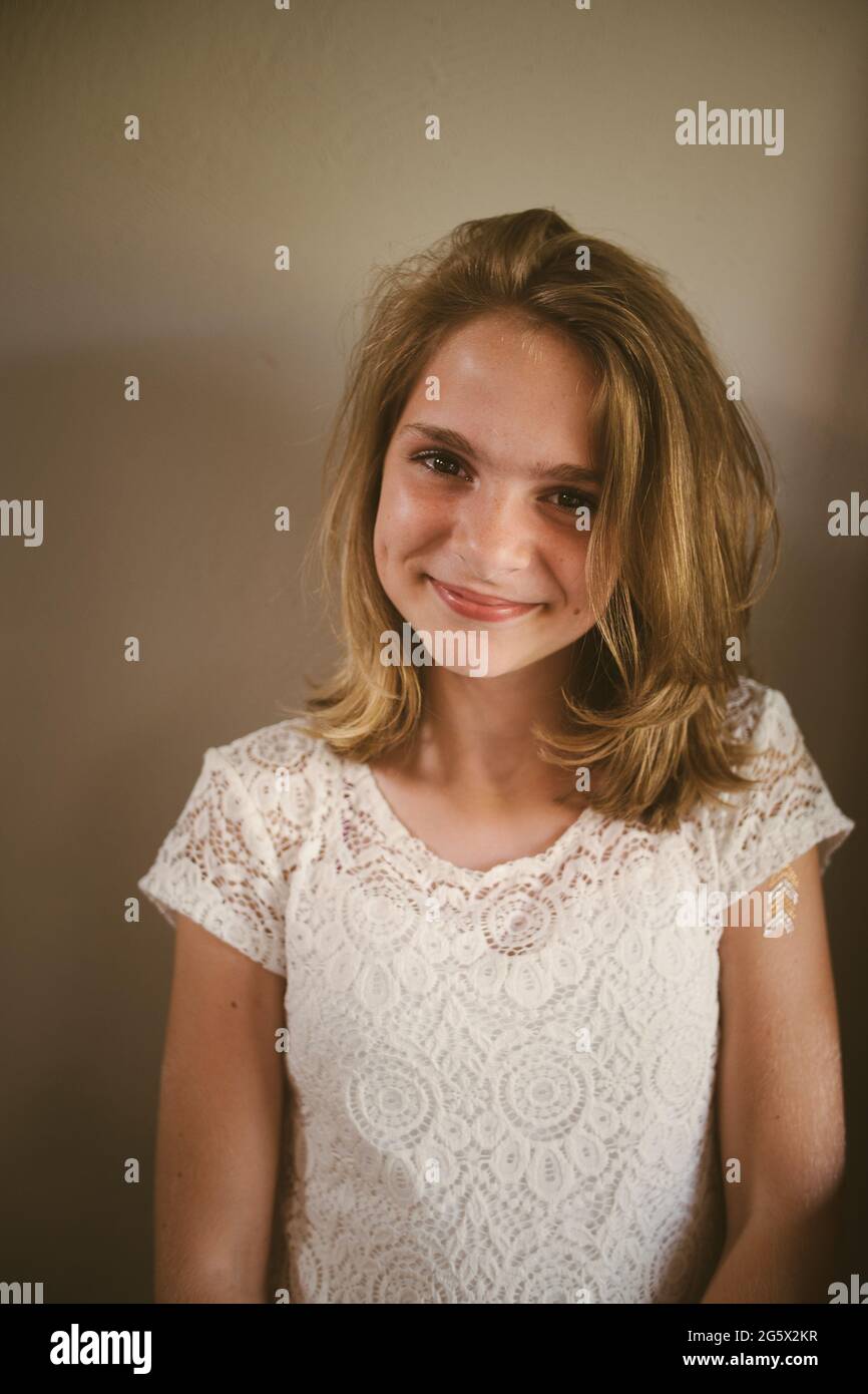 Happy teenage girl smiling. Portrait young happy positive teen in white ...