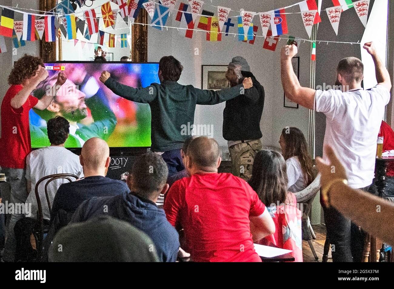 England fans celebrate beating Germany in The Prince George pub in East ...