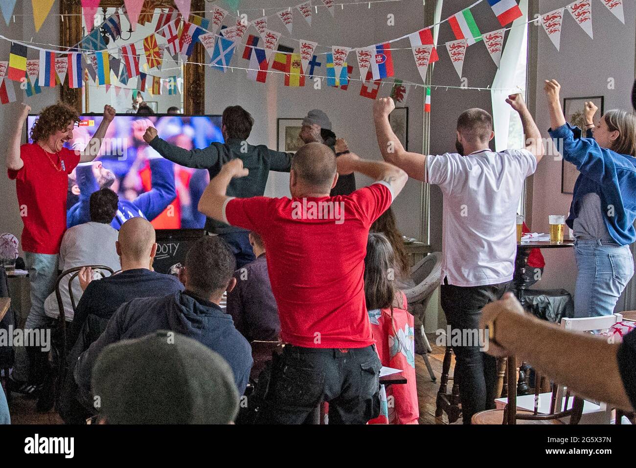 England fans celebrate beating Germany in The Prince George pub in East ...