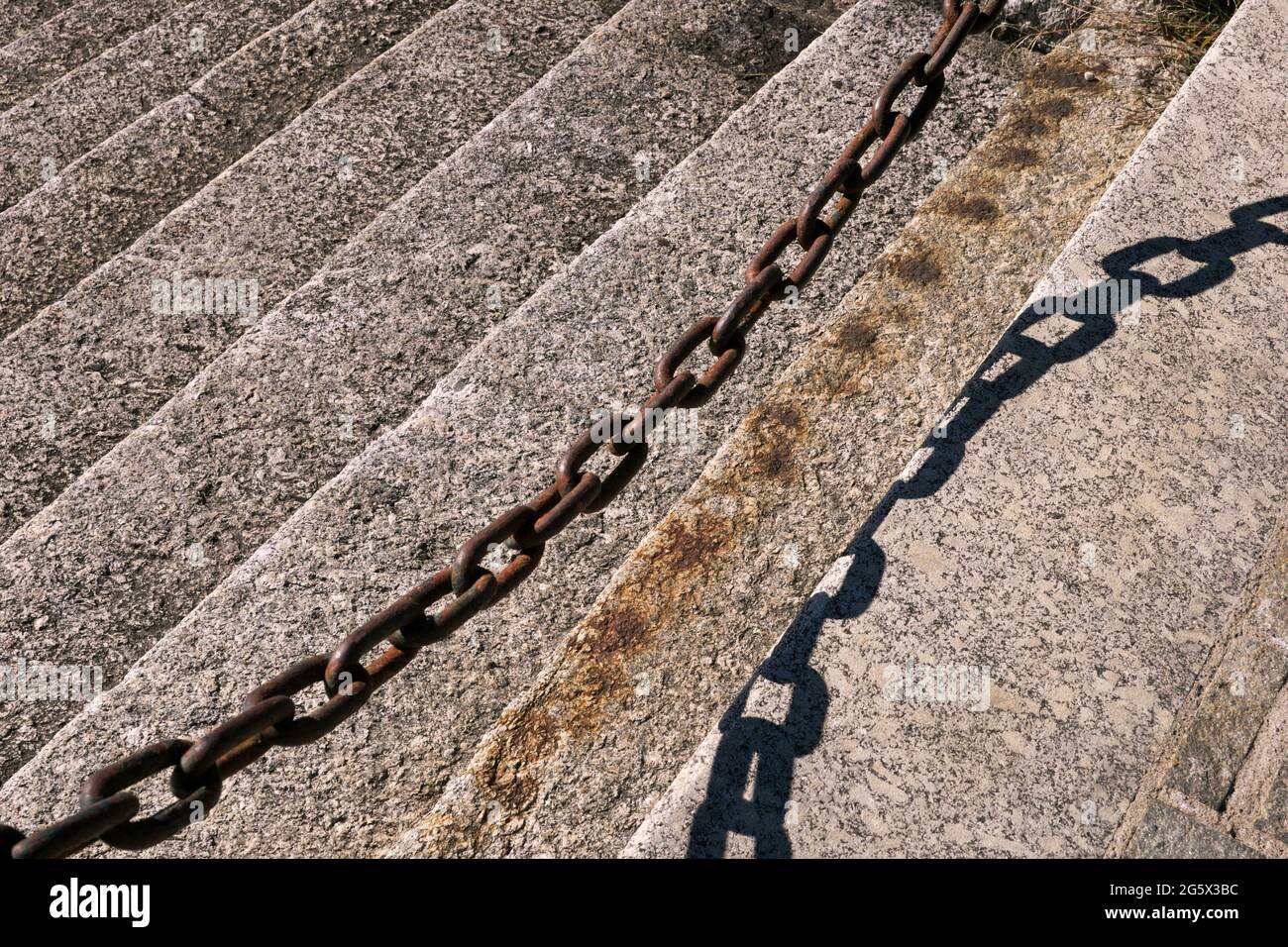 chain and its shadow over stone staircase steps Stock Photo - Alamy