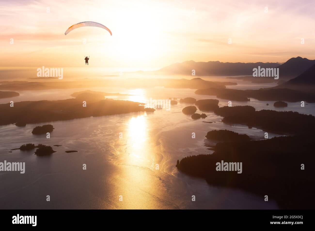 Adventure Sport Composite with Paraglider Flying over the ocean Stock ...