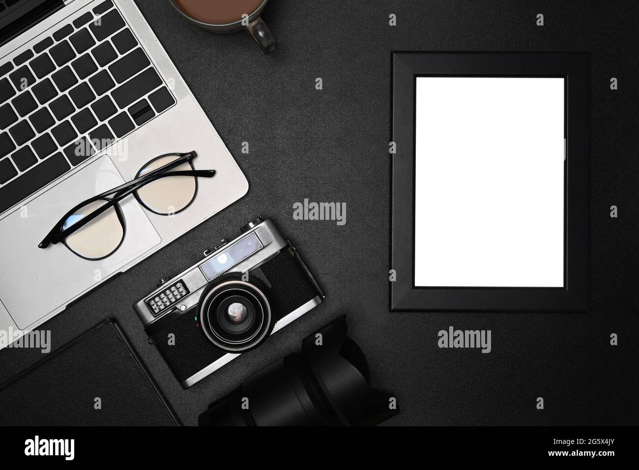 Top view computer laptop, glasses and camera on black leather Stock ...