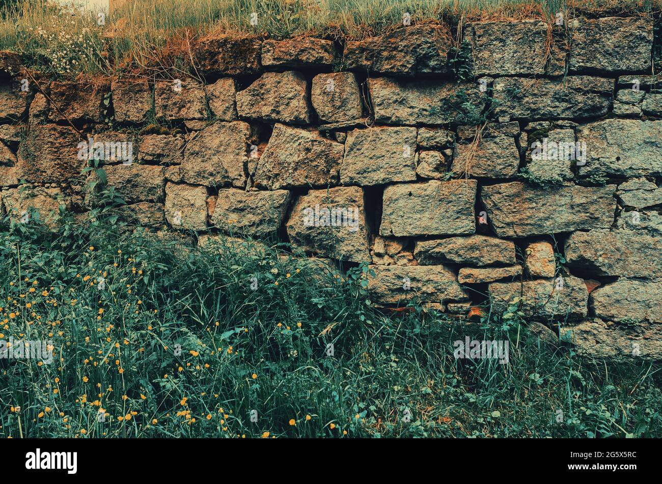 Stones overgrown by grass hi-res stock photography and images - Alamy