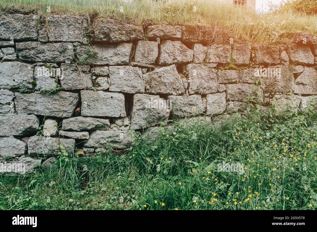 Stones overgrown by grass hi-res stock photography and images - Alamy
