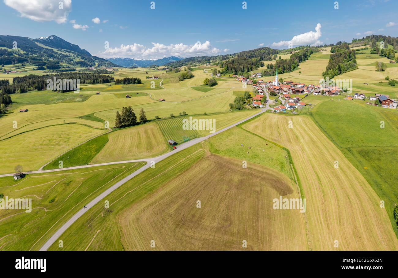 Aerial view over fields and meadows to village Vorderburg, agricultural ...