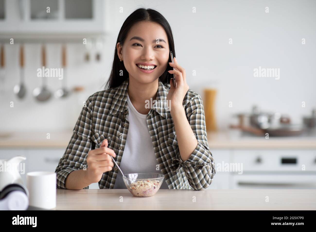 Female talking phone having breakfast hi-res stock photography and ...