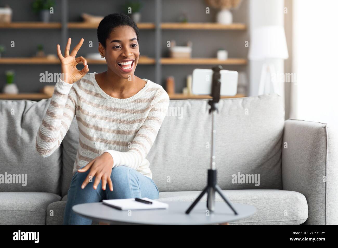 Woman recording video using mobile phone hi-res stock photography and ...