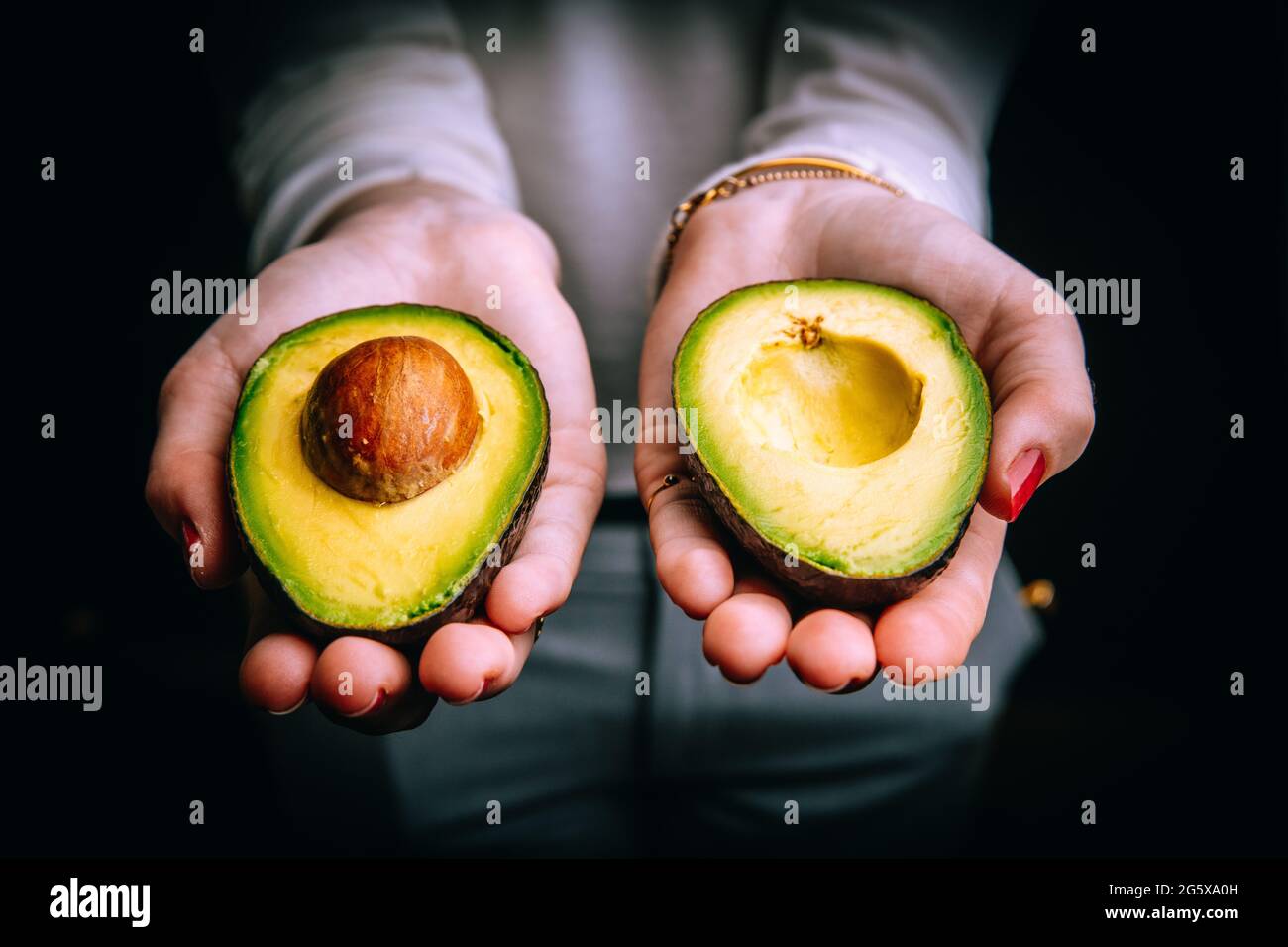 Avocado hand hi-res stock photography and images - Alamy