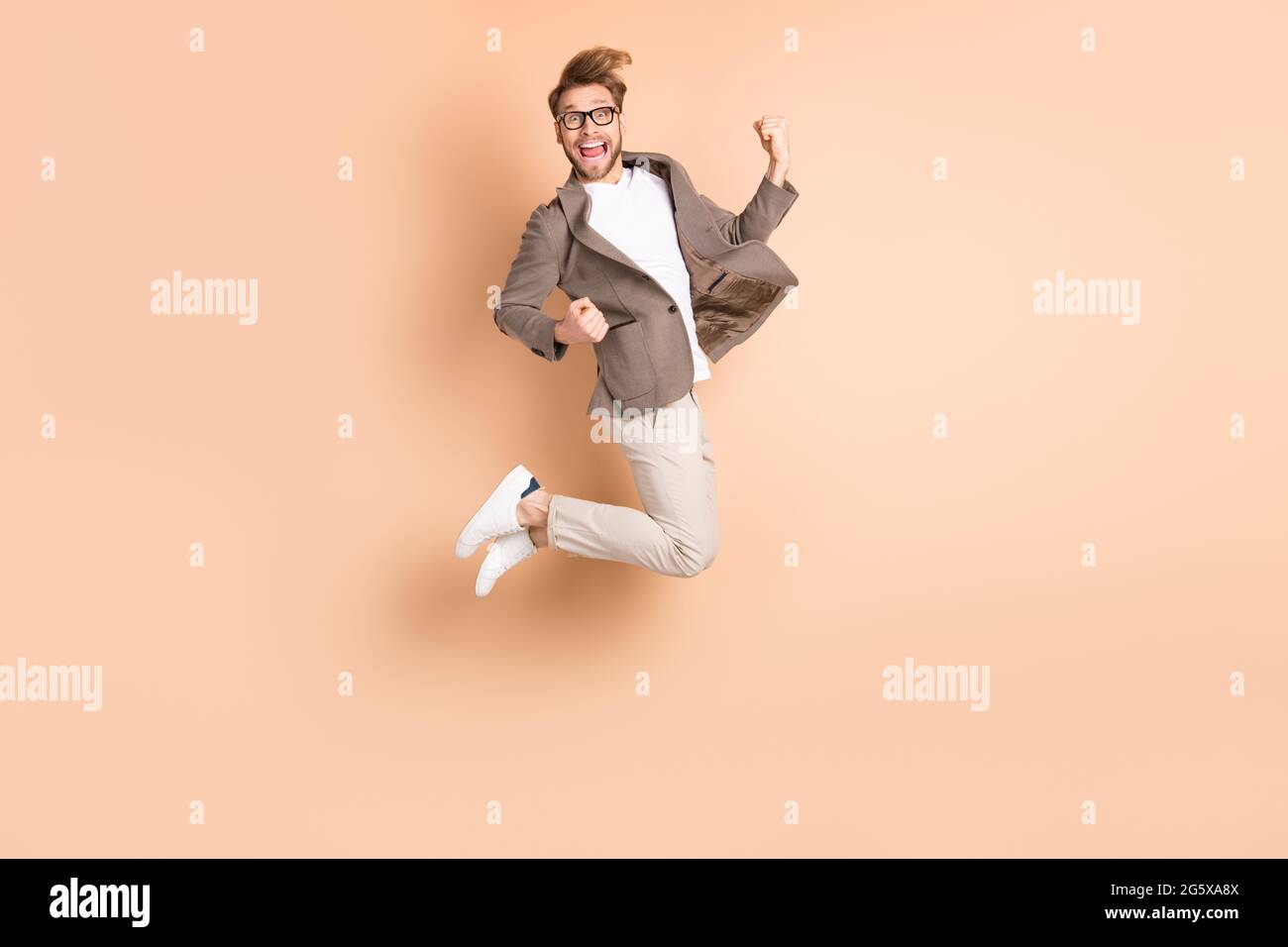 Full body photo of funky happy funny man jump up air victory success ...