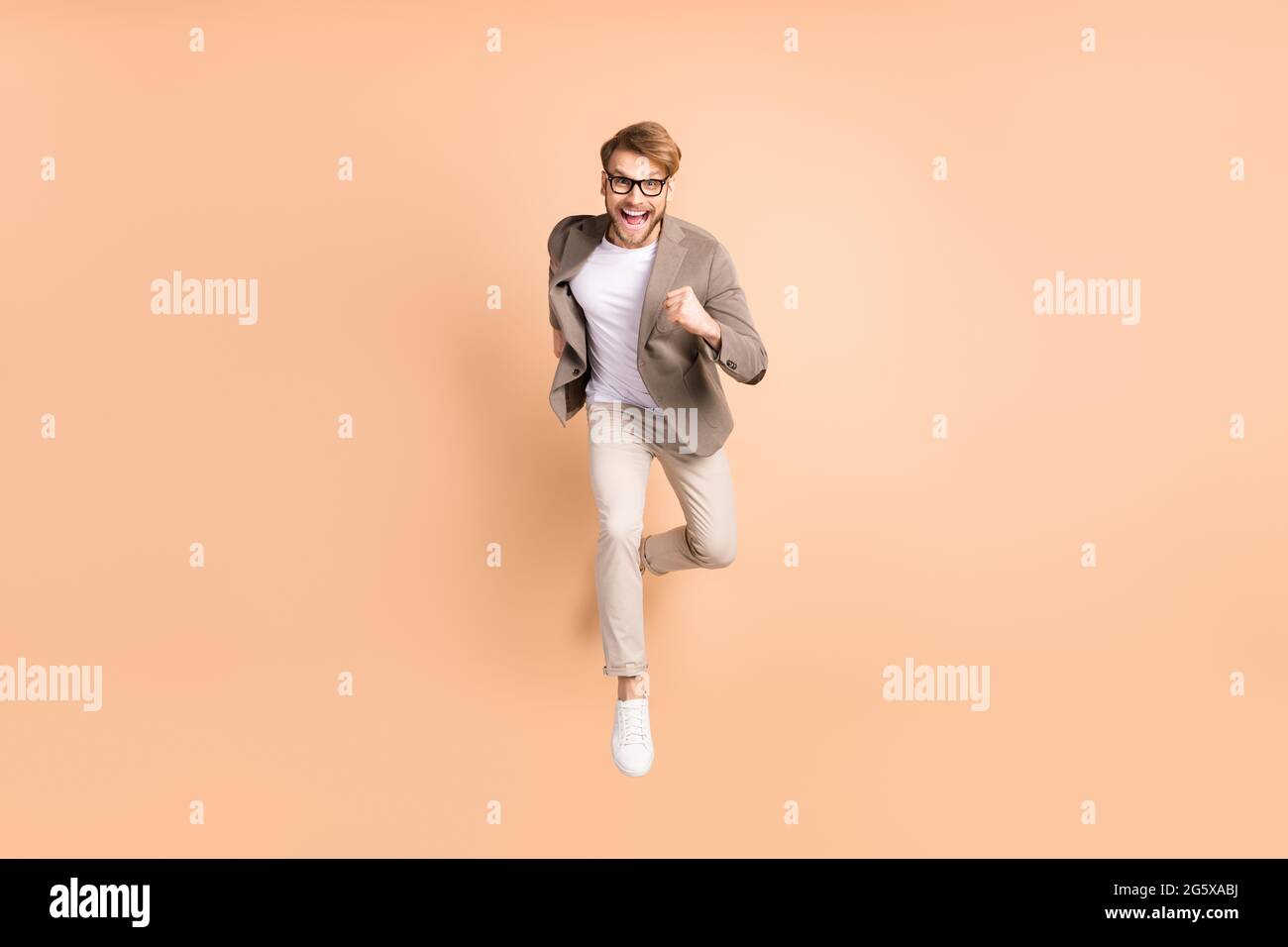 Full size photo of excited happy positive man jump up runner sale ...