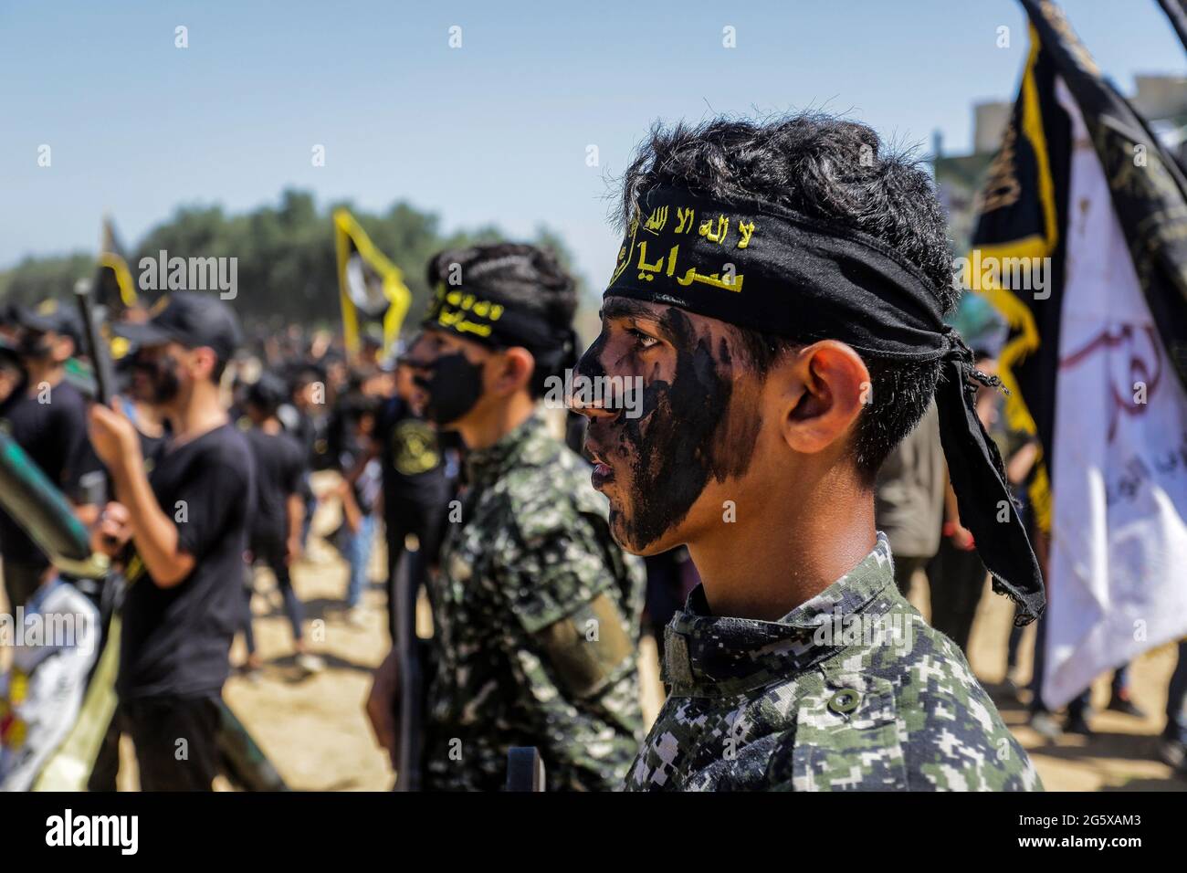 Islamic Jihad militants salute during a graduation ceremony for young ...