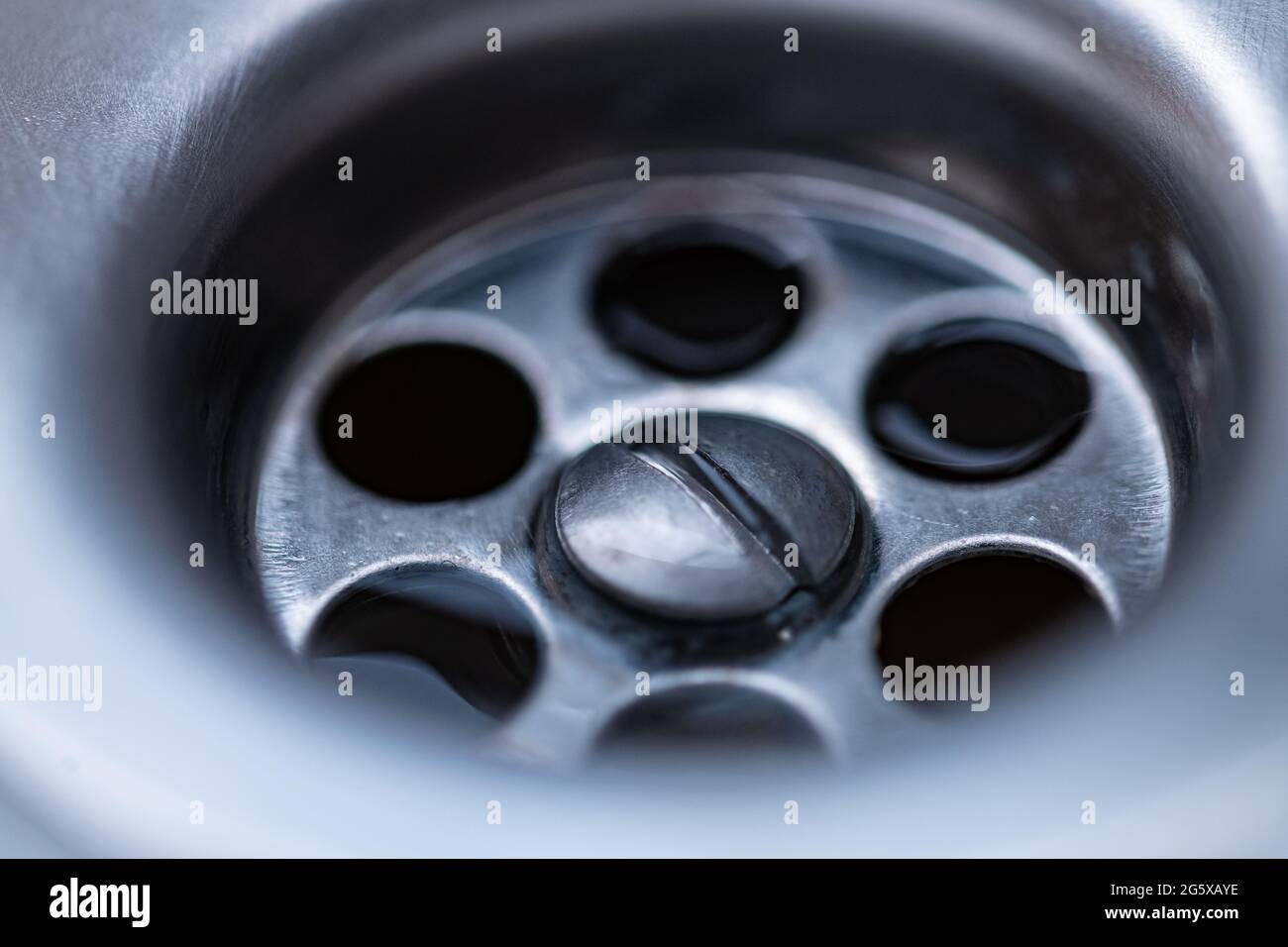 macro close-up if water flowing through a drain in a sink Stock Photo ...