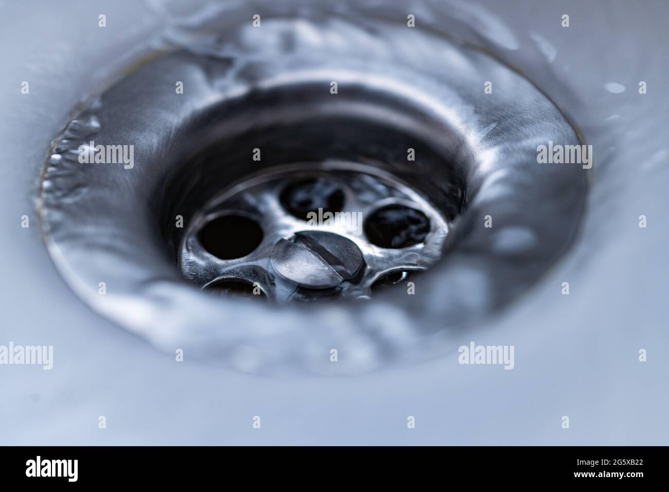 macro close-up if water flowing through a drain in a sink Stock Photo ...