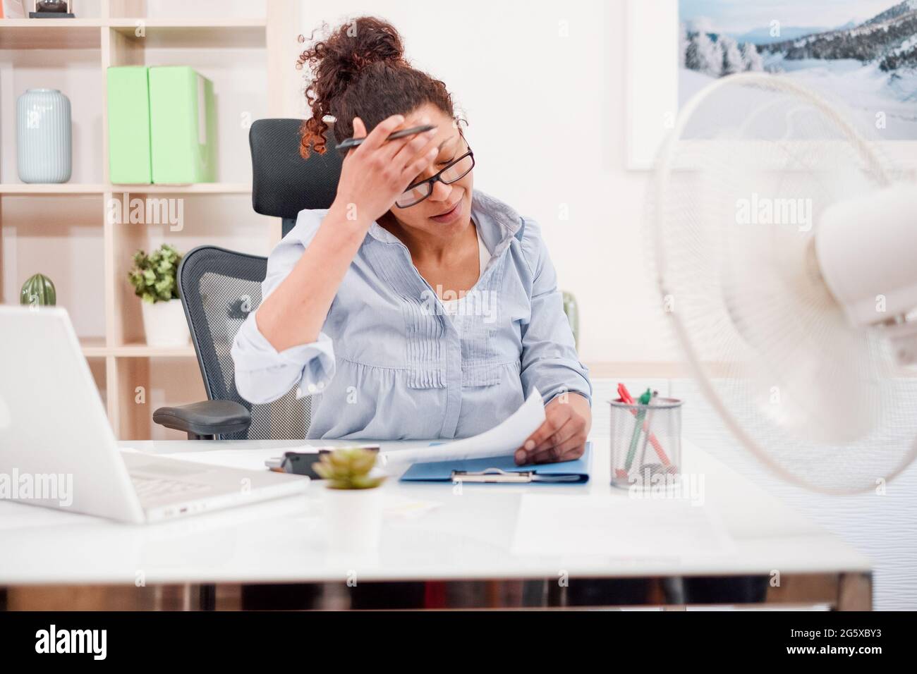 Woman working and suffering for summer hot weather Stock Photo - Alamy