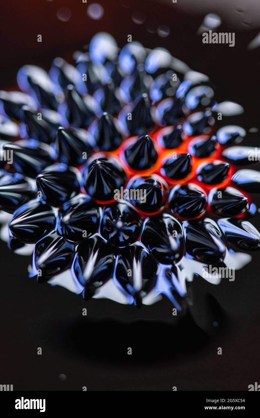 Macro close-up of ferrofluid. Red and blue Stock Photo - Alamy
