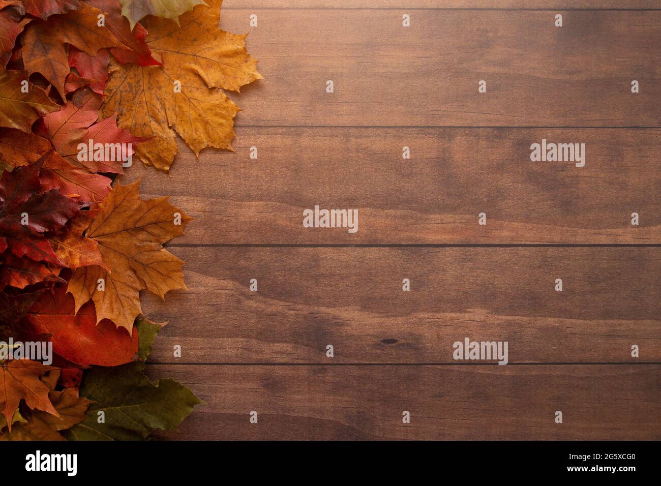 A Fall Themed Background on a Wooden Surface Stock Photo - Alamy