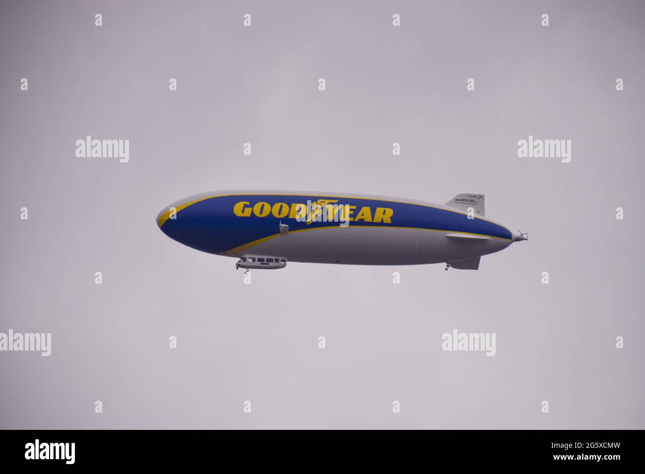 London, UK. 30th June, 2021. A Goodyear blimp seen in the sky over ...