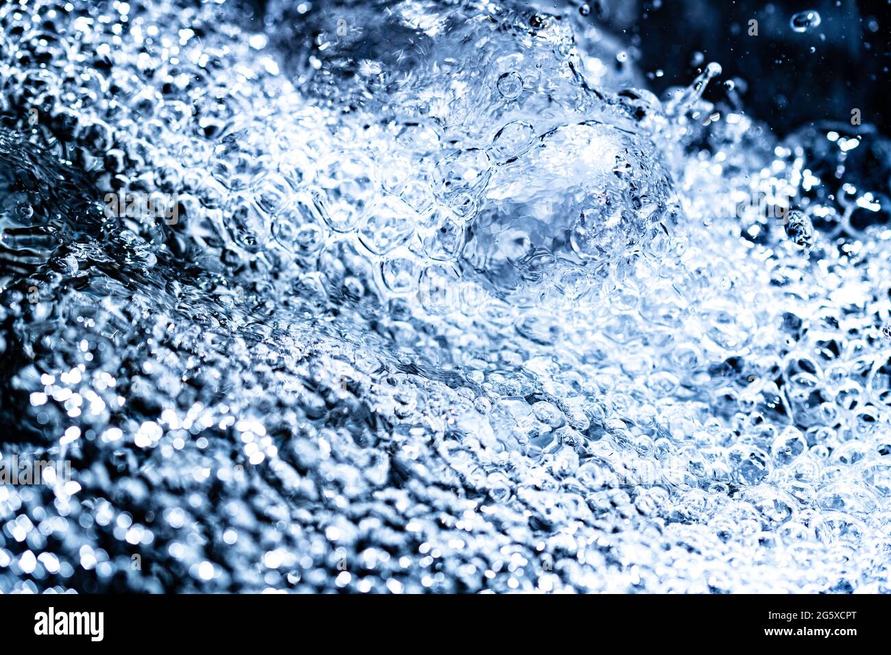 Water bubbles close-up. Tap water from a faucet. Extreme macro close-up ...