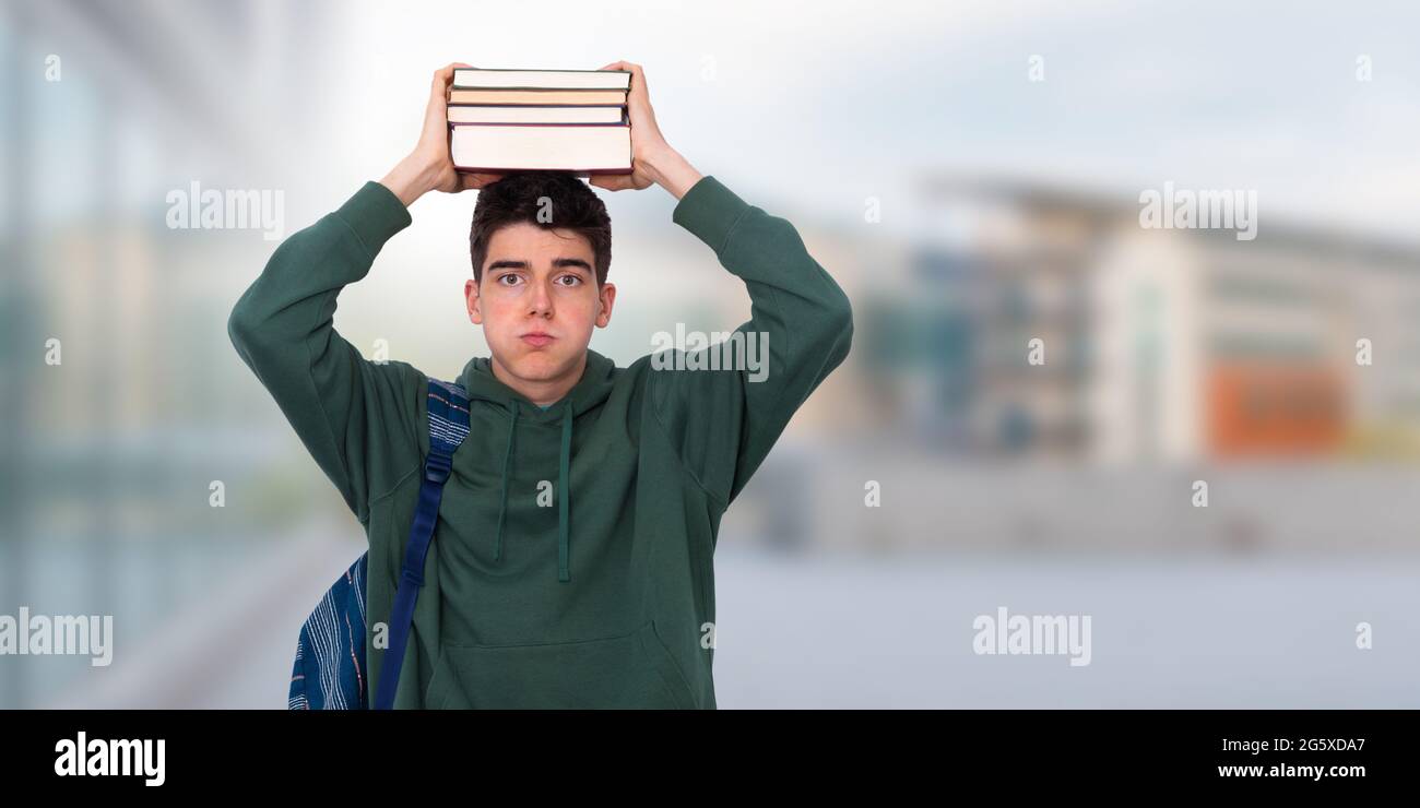 student with books at school stressed or overwhelmed Stock Photo - Alamy