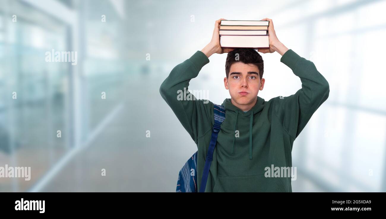 student with books at school Stock Photo - Alamy