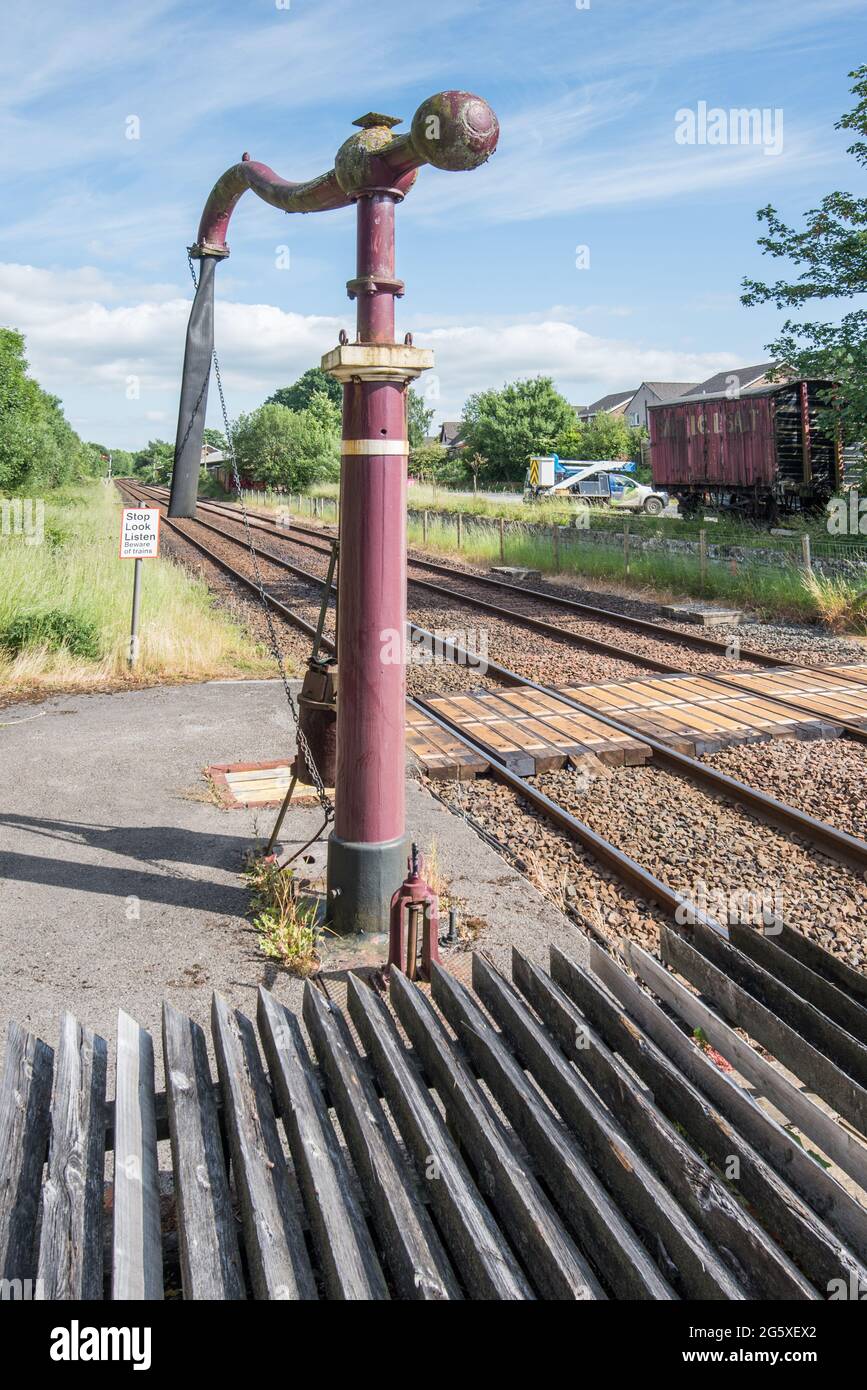 Water crane adjacent to tank tower at Appleby railway station Stock ...