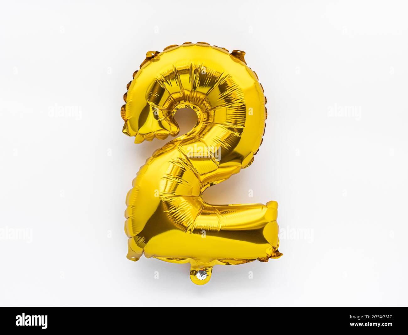 Number 2 golden foil balloon party decor on white background, birthday ...