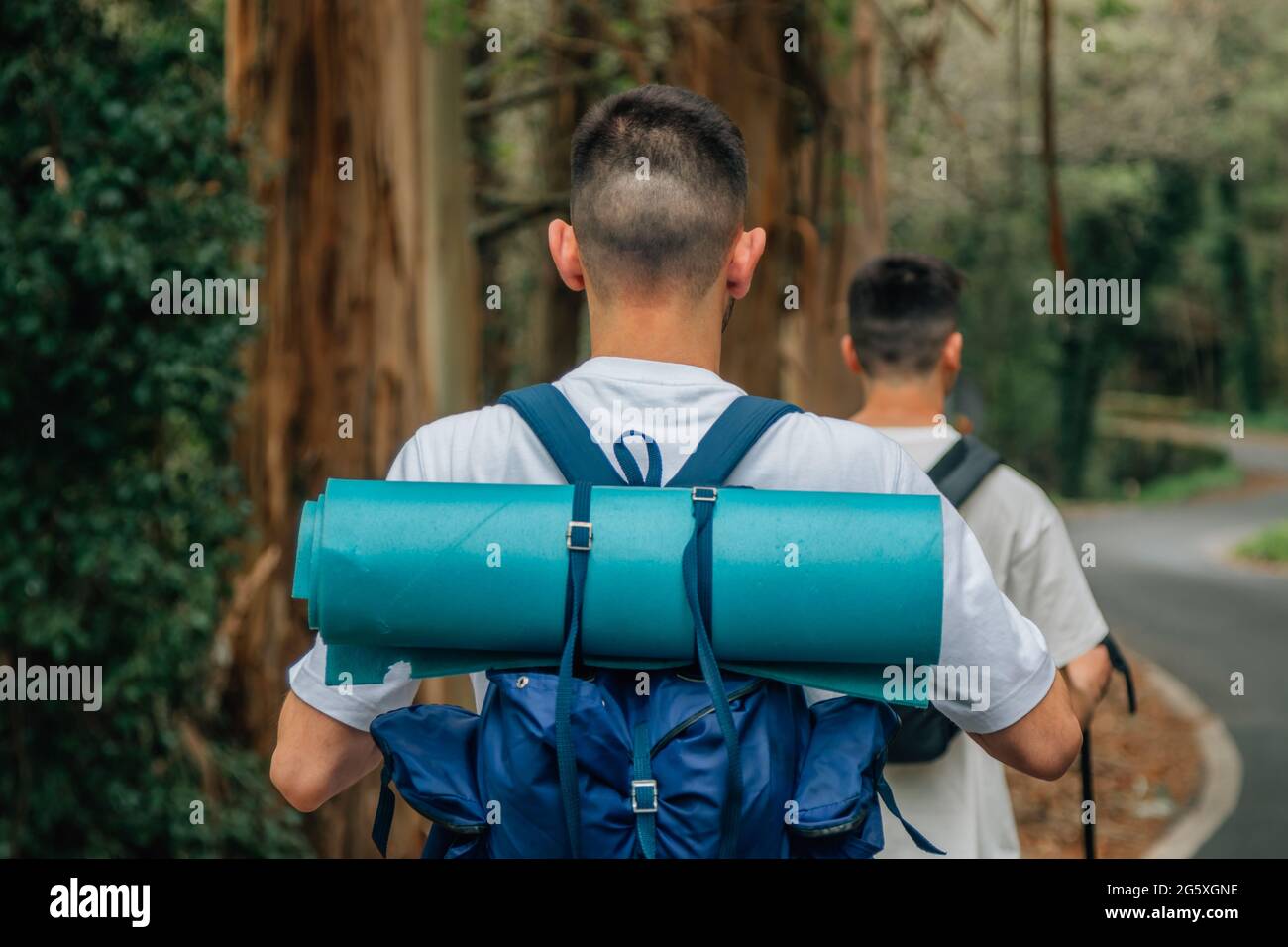 young people with backpacks while hiking Stock Photo - Alamy