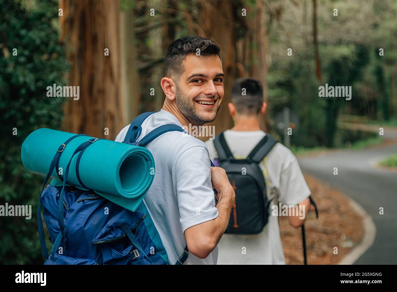 happy man looking at the camera while hiking Stock Photo - Alamy