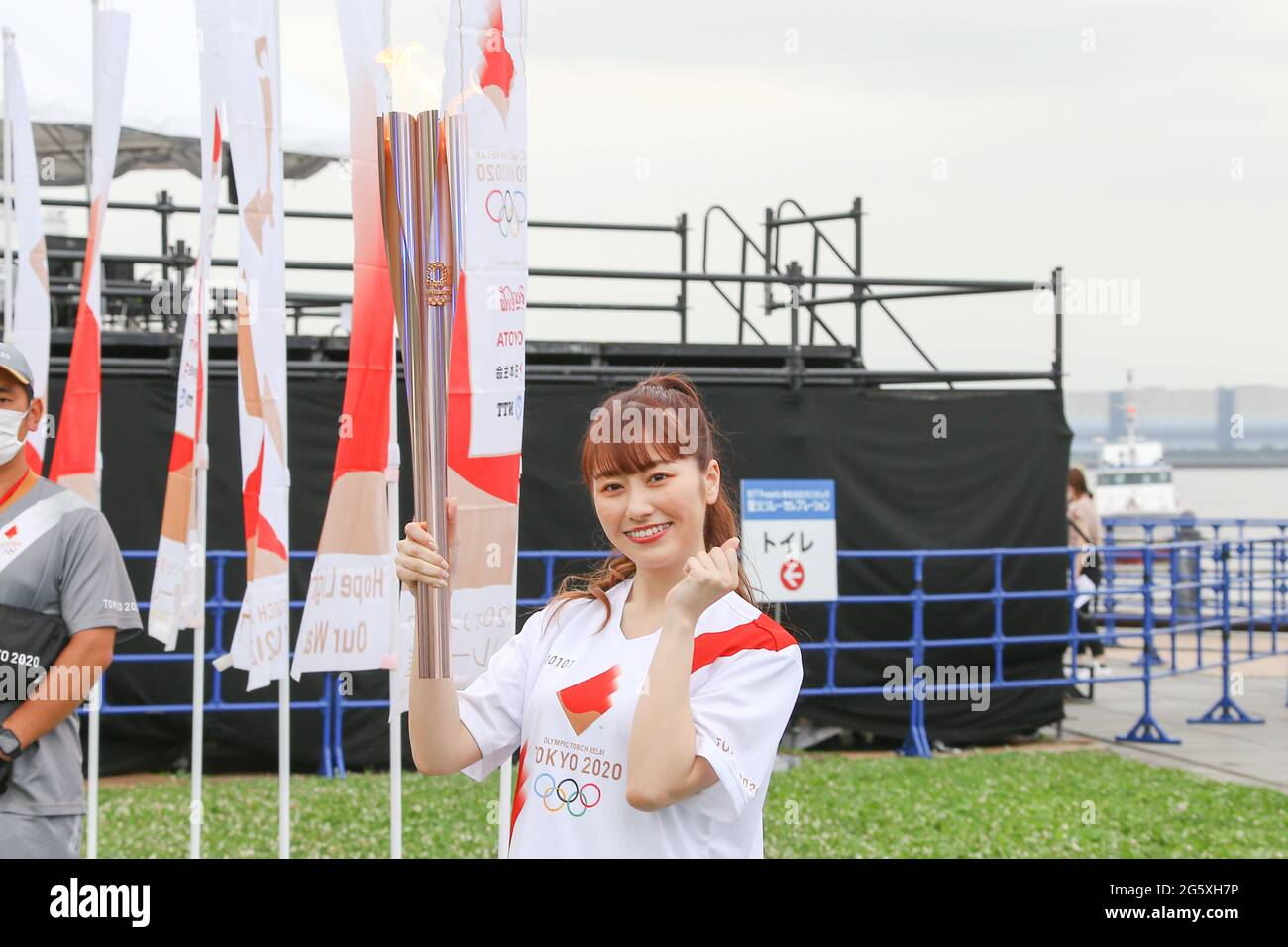 Kanagawa, Japan. 30th June, 2021. Torchbearer, Japanese singer Ayaka ...