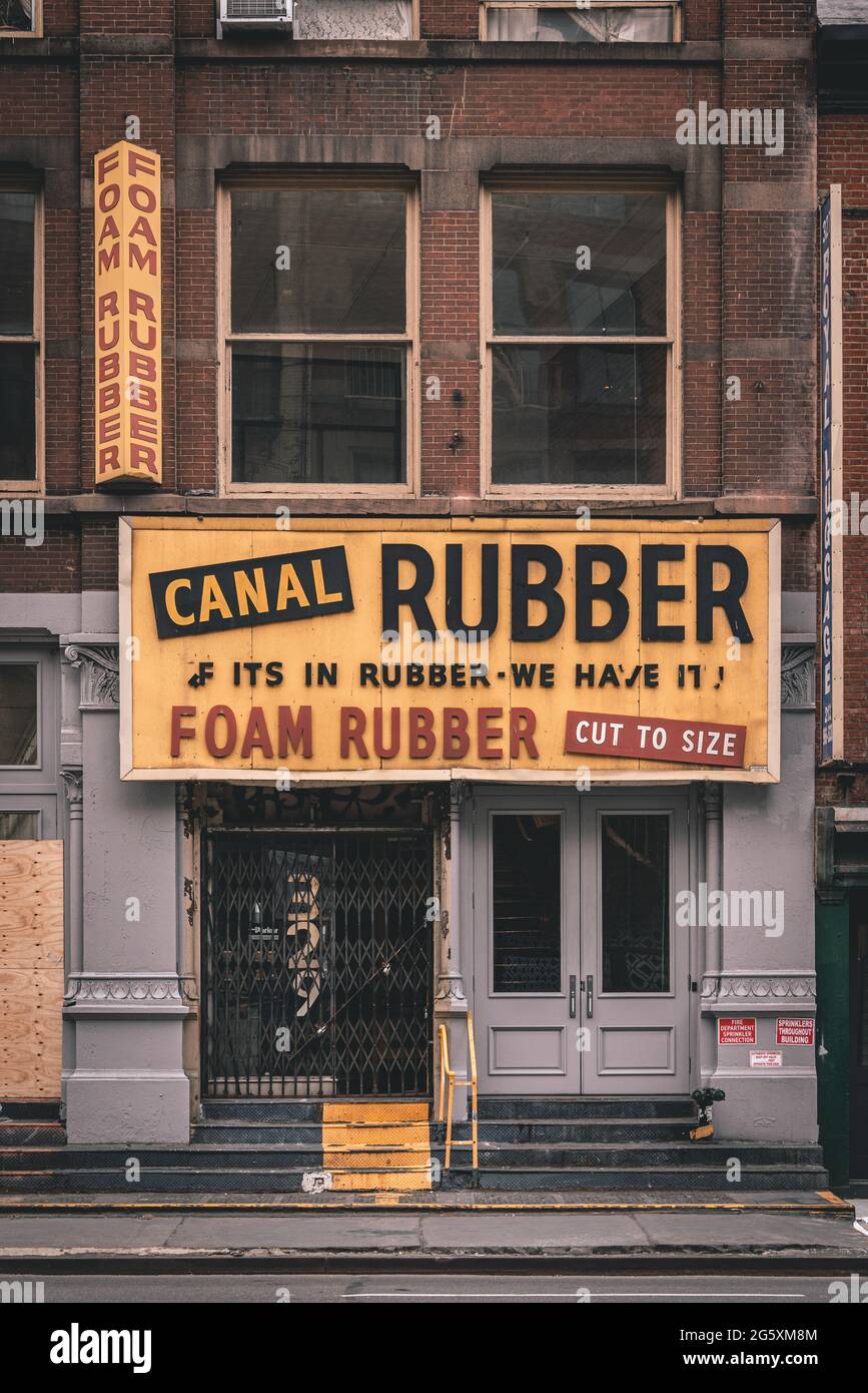Rubber business sign on Canal Street, in Manhattan, New York City Stock ...