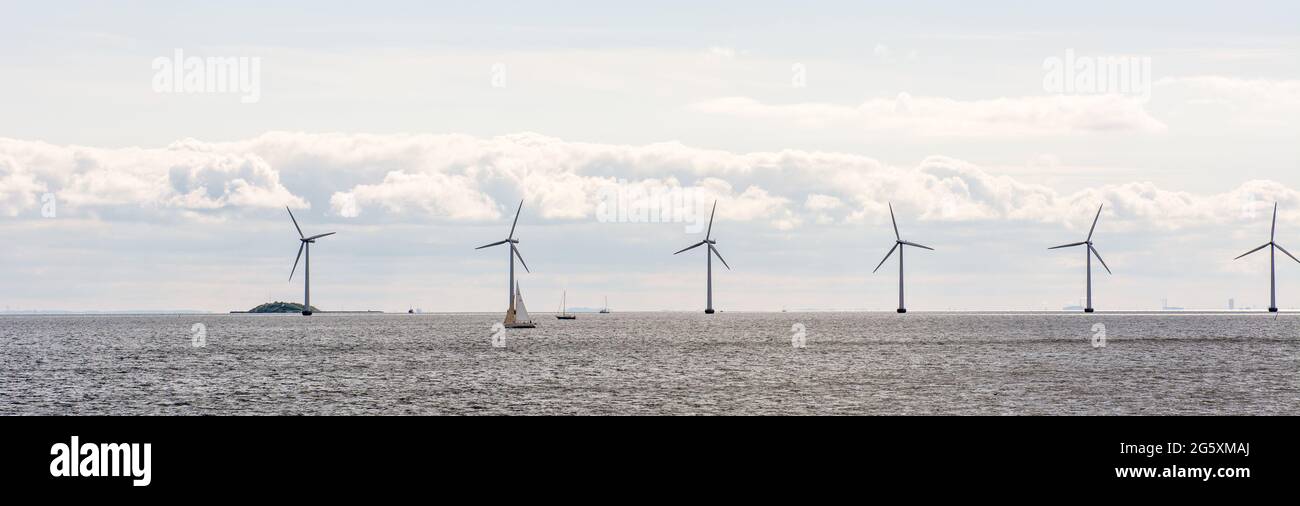Wind turbines on the water in the baltic sea of Copenhagen, Denmark ...
